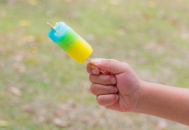 Child Hand Holding Ice Cream Stock Image - Image of blue, dairy: 37714107