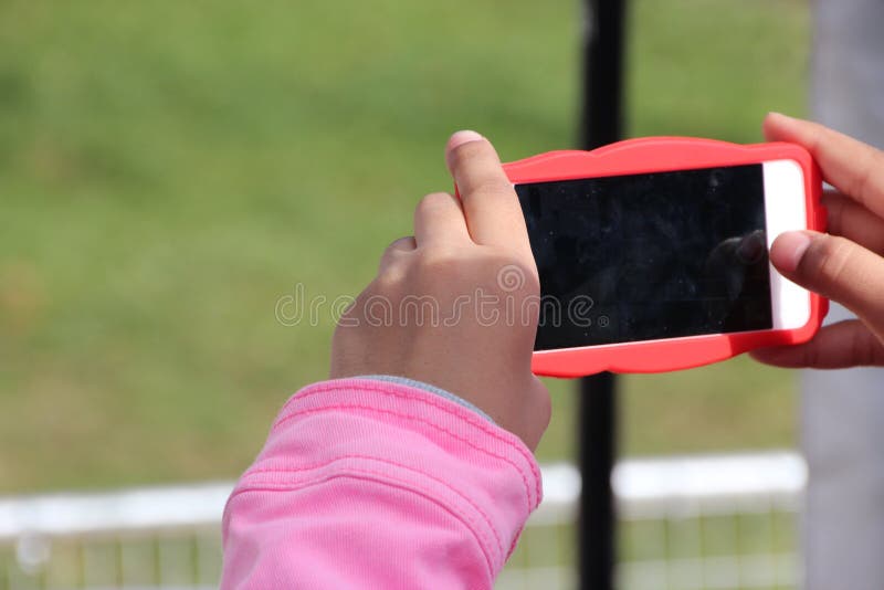 Child Hand Holding Small Camera/phone Stock Photo - Image of camera ...