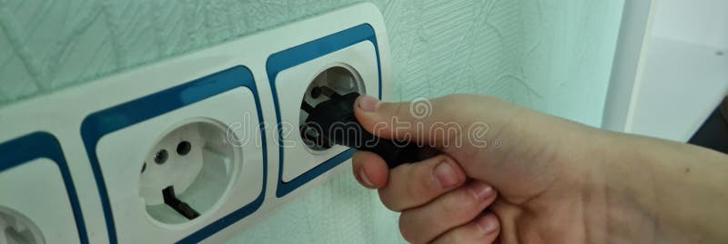Child Hand Inserts Power Cord into Socket Stock Image - Image of finger ...