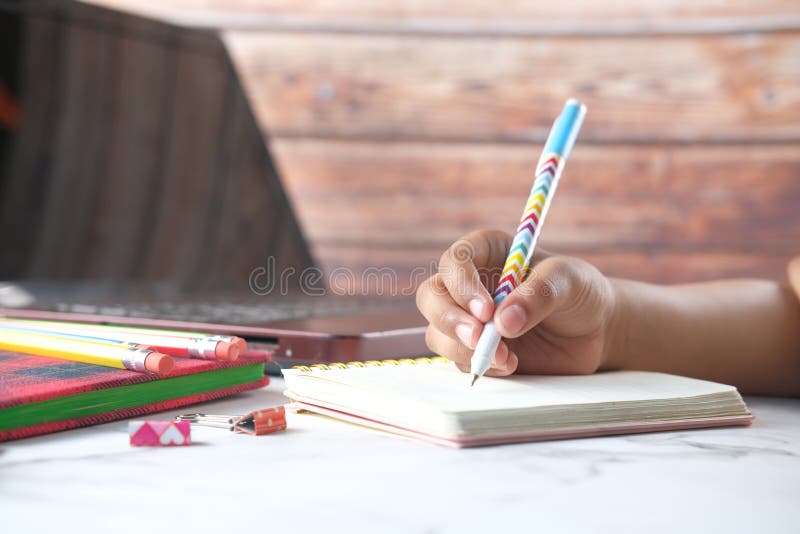 Child Hand with Pen Writing on Paper Doing Home Work Stock Image ...