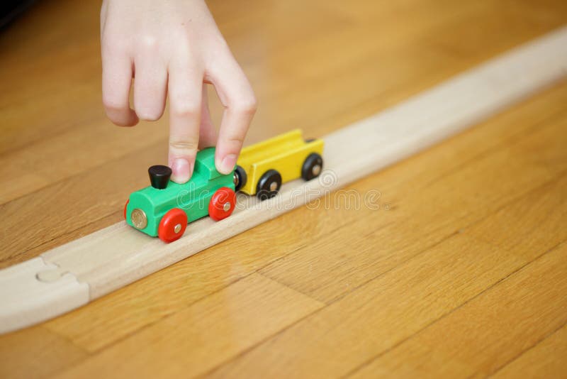 Child Hand S Playing with a Wooden Train Stock Photo - Image of train ...