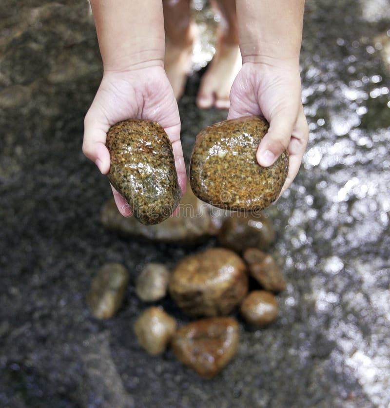 A child hand with a stone stock photo. Image of child - 5405314