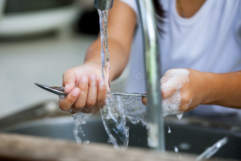Child Hand Washing Spoon Over the Sink Stock Image - Image of ...
