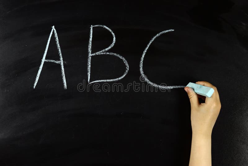 Child Hand Writes on the Blackboard Abc Stock Photo - Image of ...