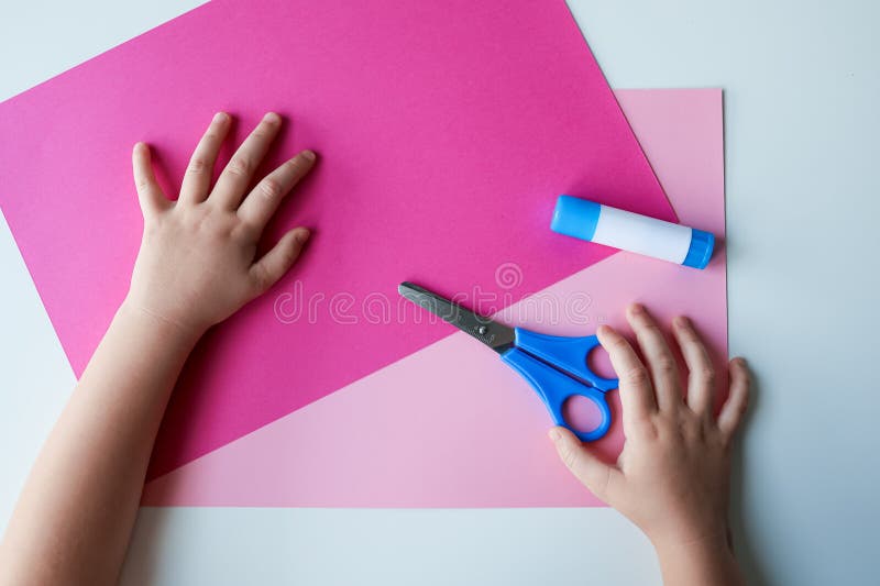 Child Handcrafting with Pink Paper, Scissors, and Glue Stock Photo ...