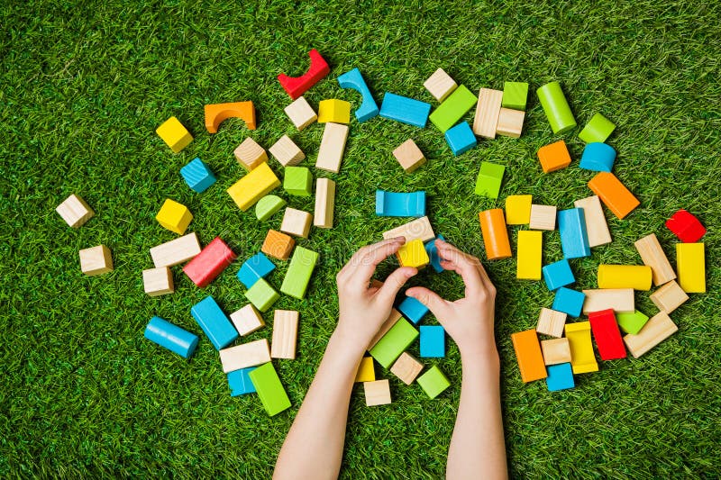 Child Hands Constructing from Color Wooden Blocks Stock Image - Image ...