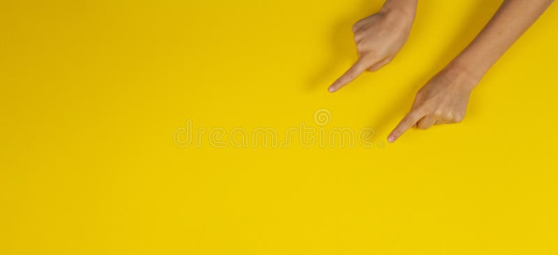 Child Hands Fingers Pointing on Yellow Background Stock Photo - Image ...
