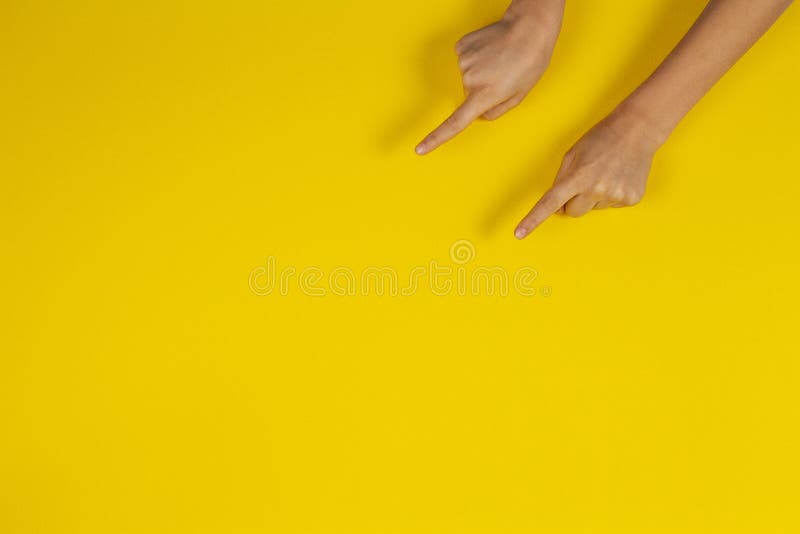 Child Hands Fingers Pointing on Yellow Background Stock Image - Image ...