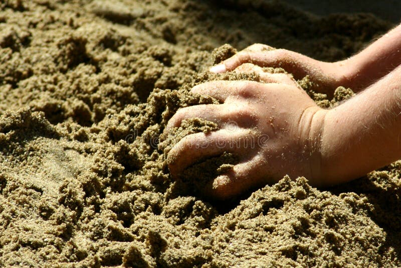 Child Hands Grabbing Sand on a Beach Stock Photo - Image of build ...