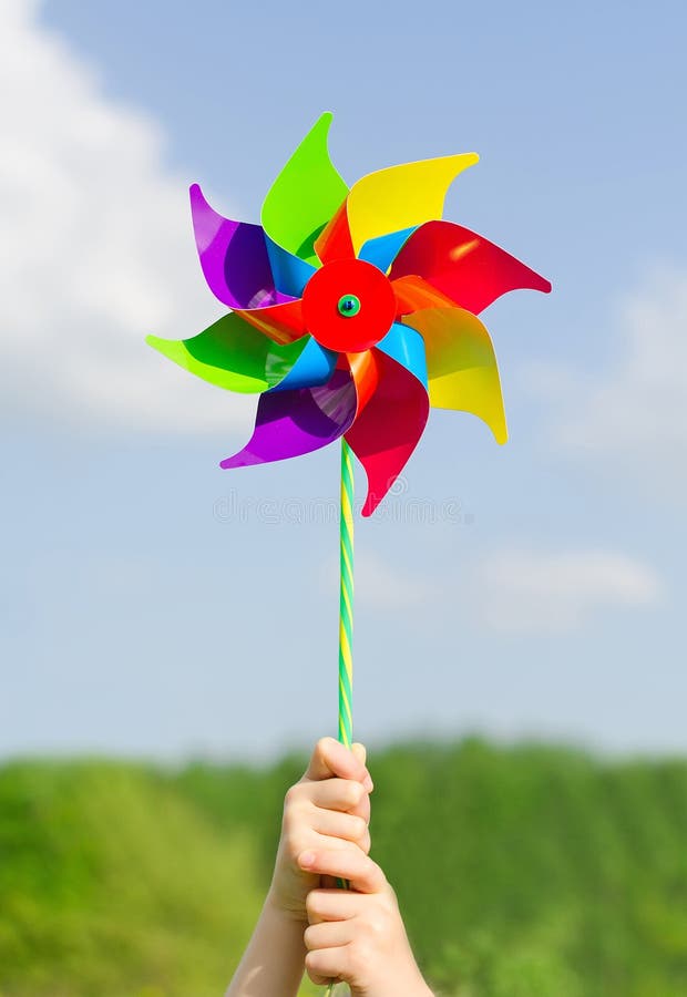 Child Hands Holding Pinwheel. Stock Image - Image of colour, girl: 41378537