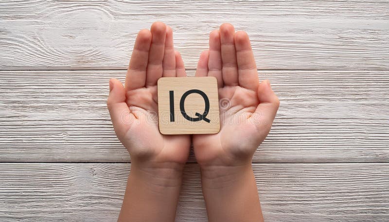 Child Hands Holding Wooden Block with IQ Text on White Wooden ...