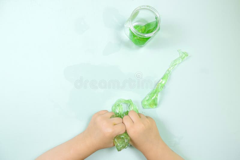 Child Hands with Sticky Green Slime, Selective Focus Stock Photo ...