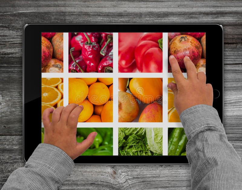 Child Hands on Tablet Computer with Mixed Fruit Picture Stock Image ...
