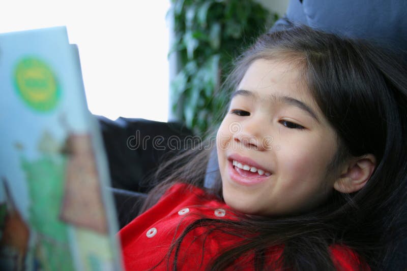 Child Happily Reading a Book Stock Image - Image of emotion, expression ...