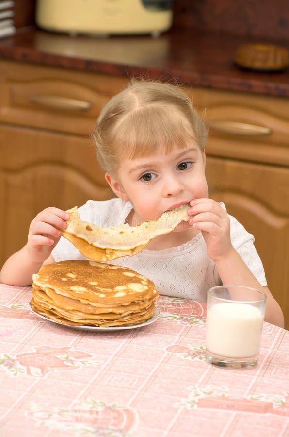 The child has breakfast stock image. Image of cuisine - 23025451