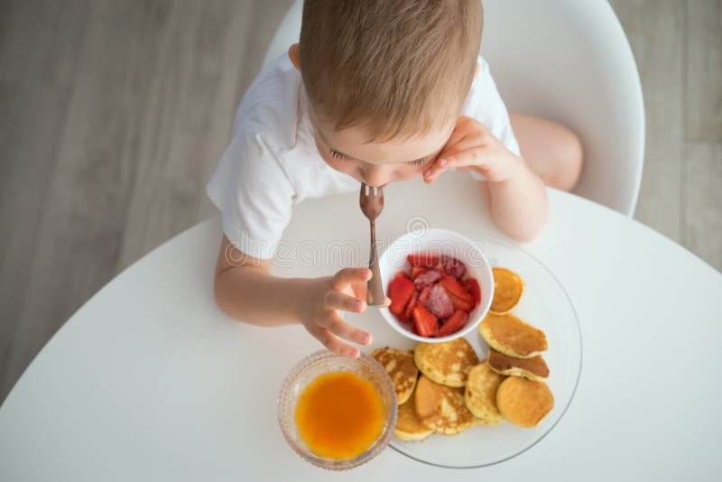 The Child Has Breakfast on a Sunny Morning Stock Image - Image of ...
