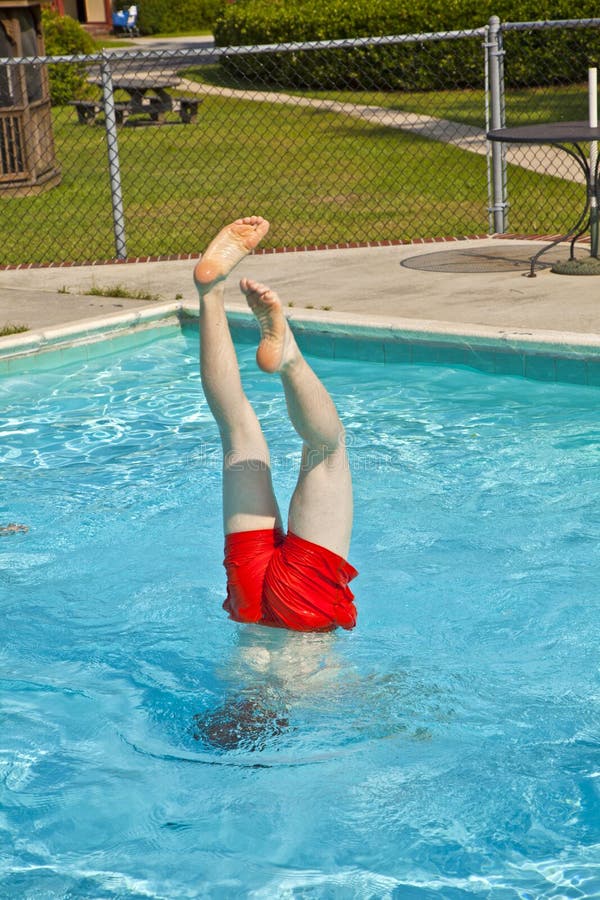 Teenage Boy Doing a Handstand in a Pool Stock Photo - Image of ...