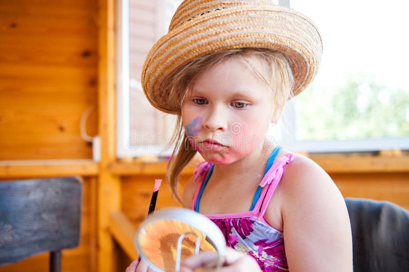 Child in a Hat and with a Pattern on the Face Stock Photo - Image of ...