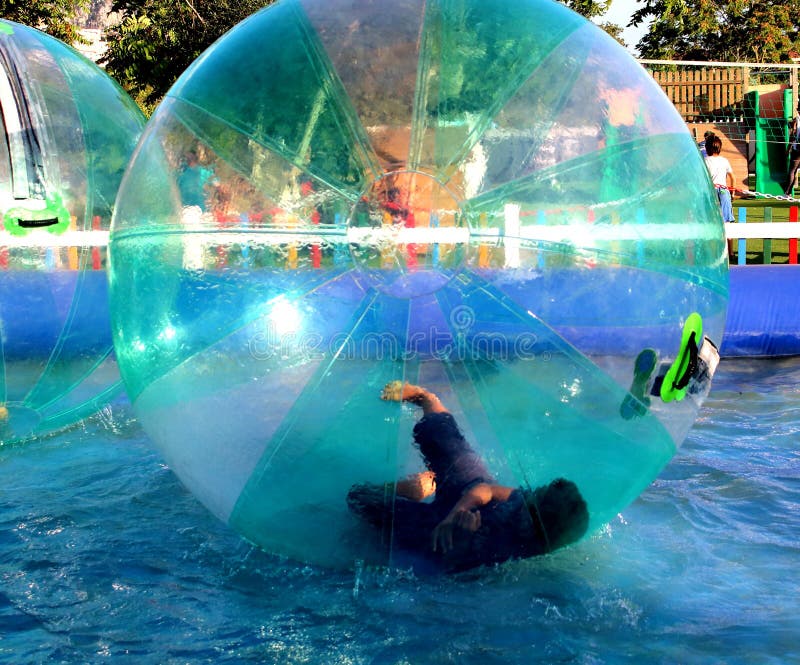 Child Having Fun Inside the Inflatable Ball Floating on the Water in ...