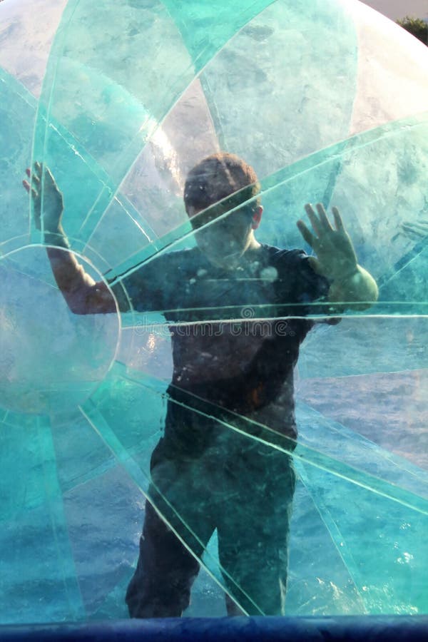 Child Having Fun Inside the Inflatable Ball Floating on the Water in ...