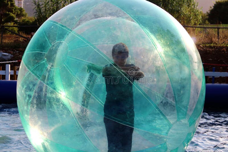 Child Having Fun Inside the Inflatable Ball Floating on the Water in ...