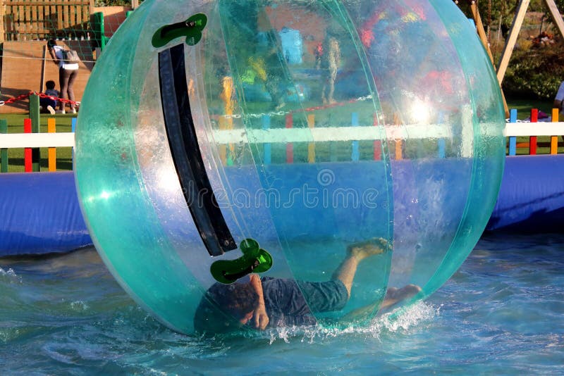 Child Having Fun Inside the Inflatable Ball Floating on the Water in ...