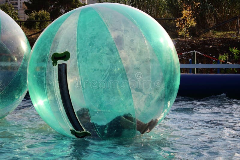 Child Having Fun Inside the Inflatable Ball Floating on the Water in ...