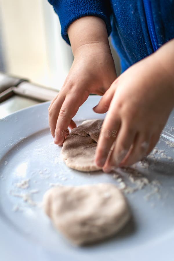 Child Having Fun Modeling Dough, Authentic Activity for Fine Motor ...