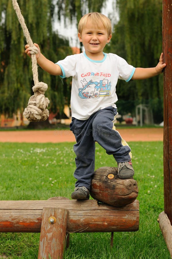 Child Standing on Tree Branch Stock Image - Image of surmount, bough ...