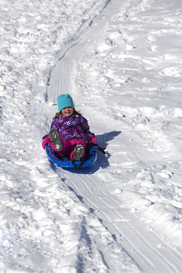 Child Sledding Down a Snow Hill Stock Photo - Image of hill, sled: 39398632