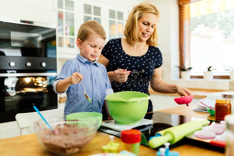 Child Helping Mother Make Cookies Stock Photo - Image of child, house ...