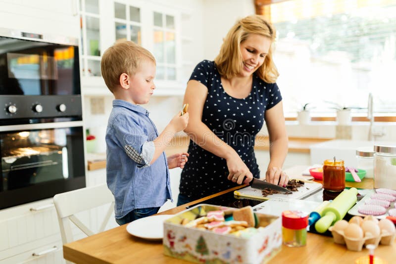 Child Helping Mother Bake Cookies Stock Photo - Image of happiness ...