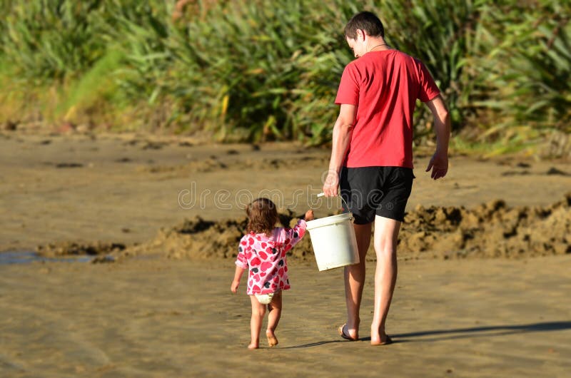 Child Helps To Carry a Heavy Bucket Stock Image - Image of colorful ...