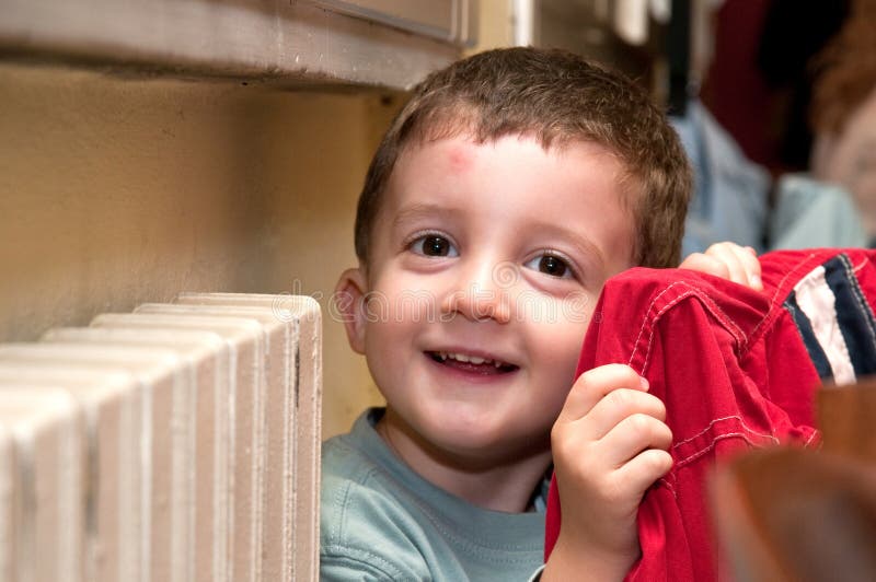 Child hides stock image. Image of happy, little, smile - 49923065