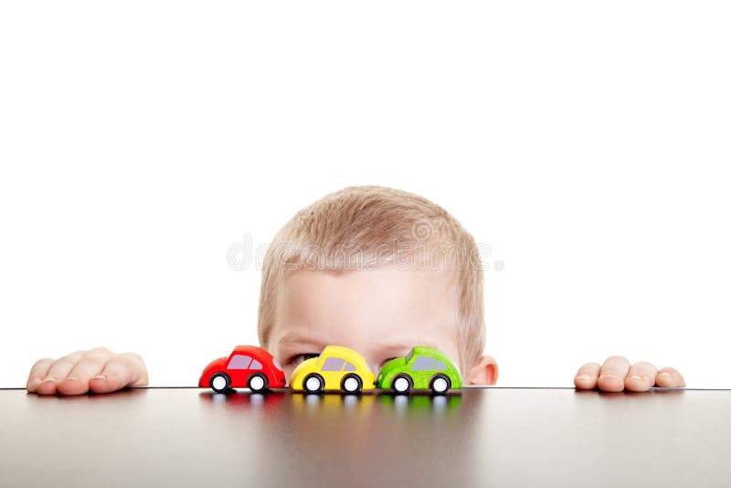 Child Hiding Behind Toy Cars Stock Image - Image of hide, drive: 18943683