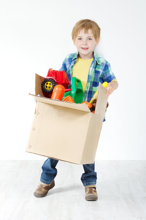 Child Holding Cardboard Box Packed with Toys Stock Image - Image of ...