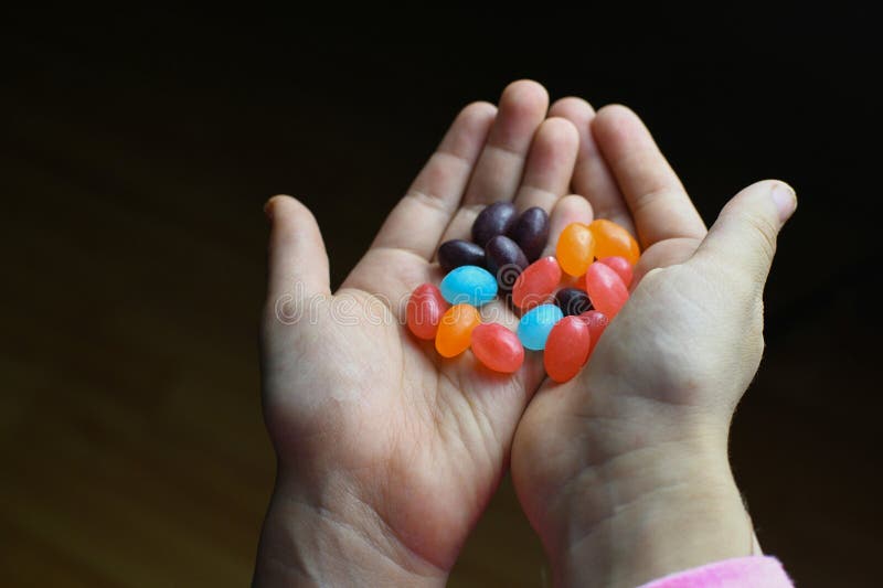 A Child Holding Colourful Jelly Beans Stock Image - Image of fruity ...
