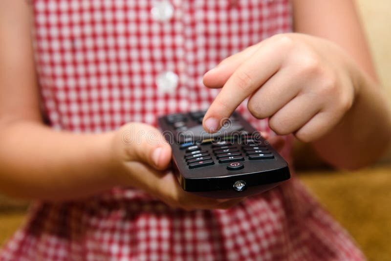 Child holding remote TV stock image. Image of hand, media - 128958223