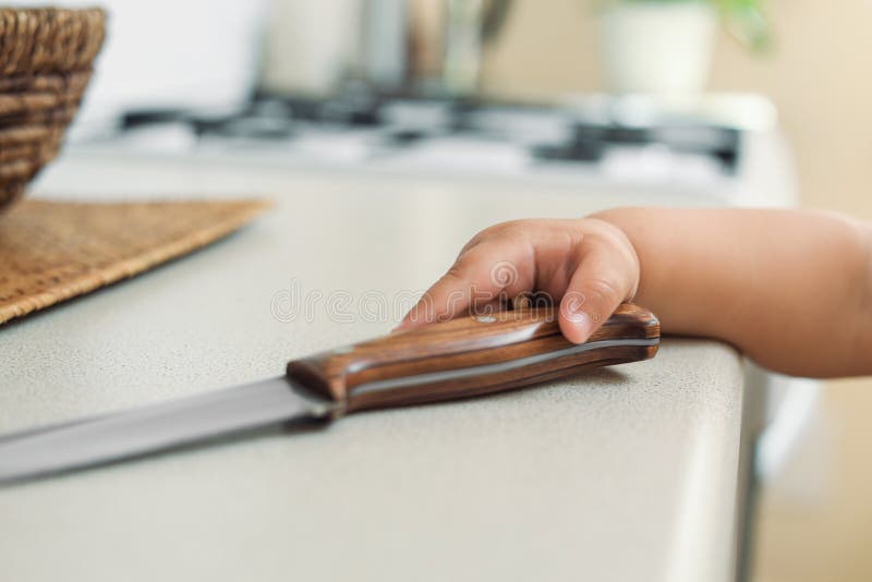 Child Holding Sharp Knife, Closeup. Dangers in Kitchen Stock Photo ...