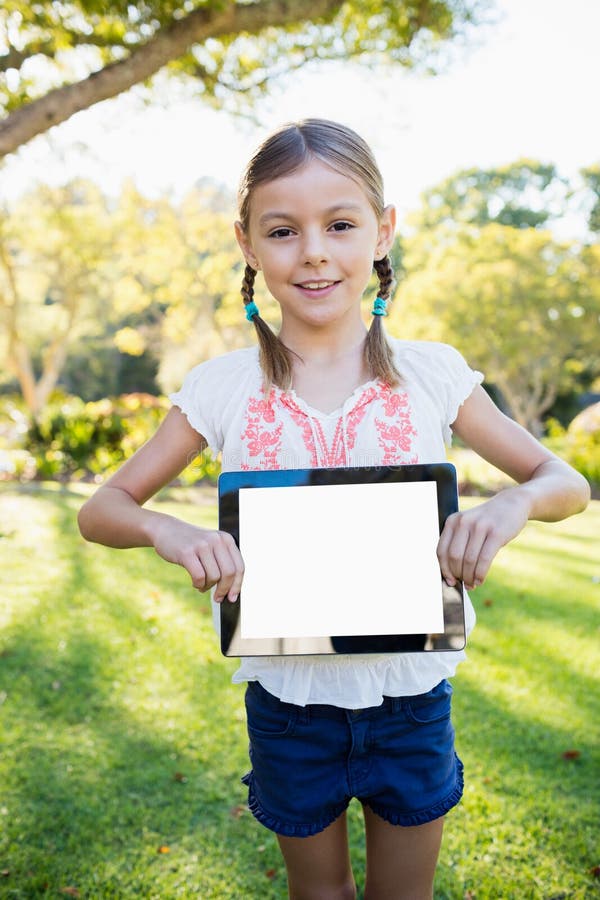 Child Holding Tablet during a Sunny Day Stock Photo - Image of summer ...