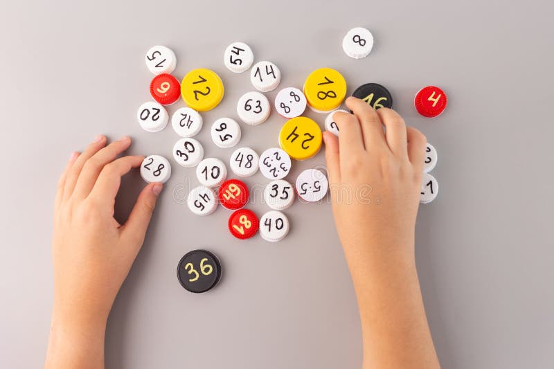 Child Holding White Cap with Math Problems, on Gray Background ...