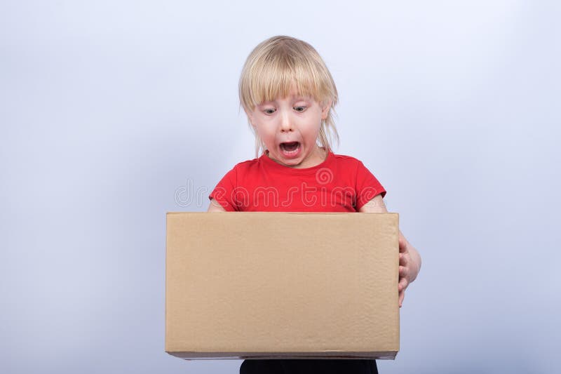Child Holds Box in Hands on White Background. Cute Little Boy is Happy ...
