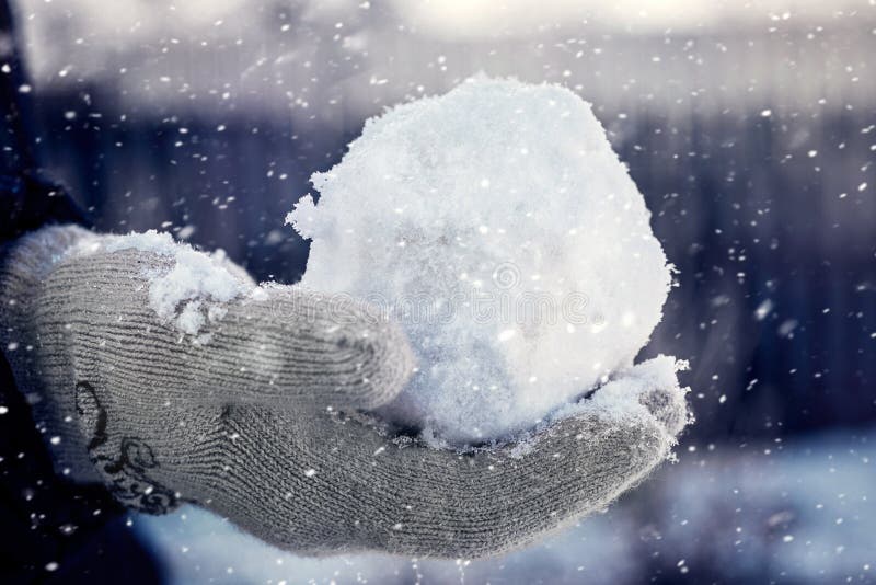 The Child Holds a Snowball in His Hand Stock Photo - Image of mitten ...