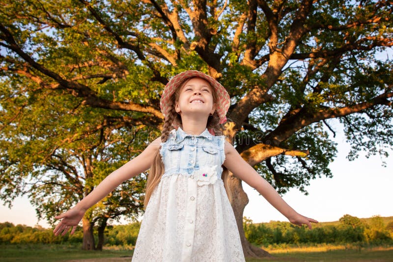 Child and a Huge Tree in the Forest. Old Oak and a Little Girl Stock ...
