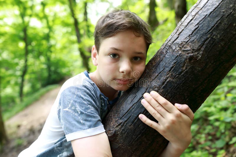 Child Hugging Tree Trunk in Forest Stock Image - Image of ecology, hand ...