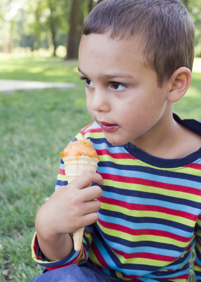 Child with ice cream stock photo. Image of green, holding - 62190586