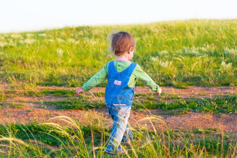 Child in the Jeans Coverall Walk with Vigorous Strides Stock Image ...
