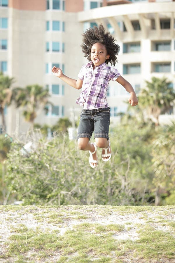 Child jumping stock photo. Image of jump, african, composition - 14497224