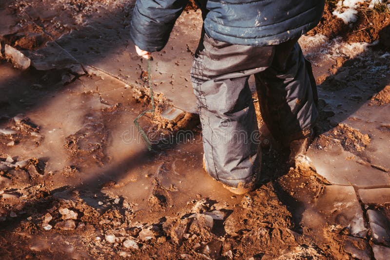 Child Jumping Around in the Mud Stock Photo - Image of adorable ...