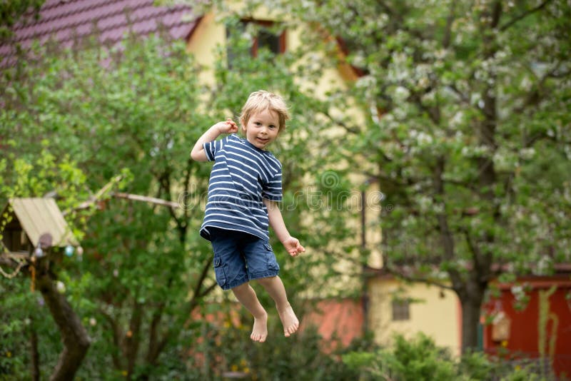 Child, Jumping High on a Trampoline Stock Image - Image of cute, active ...